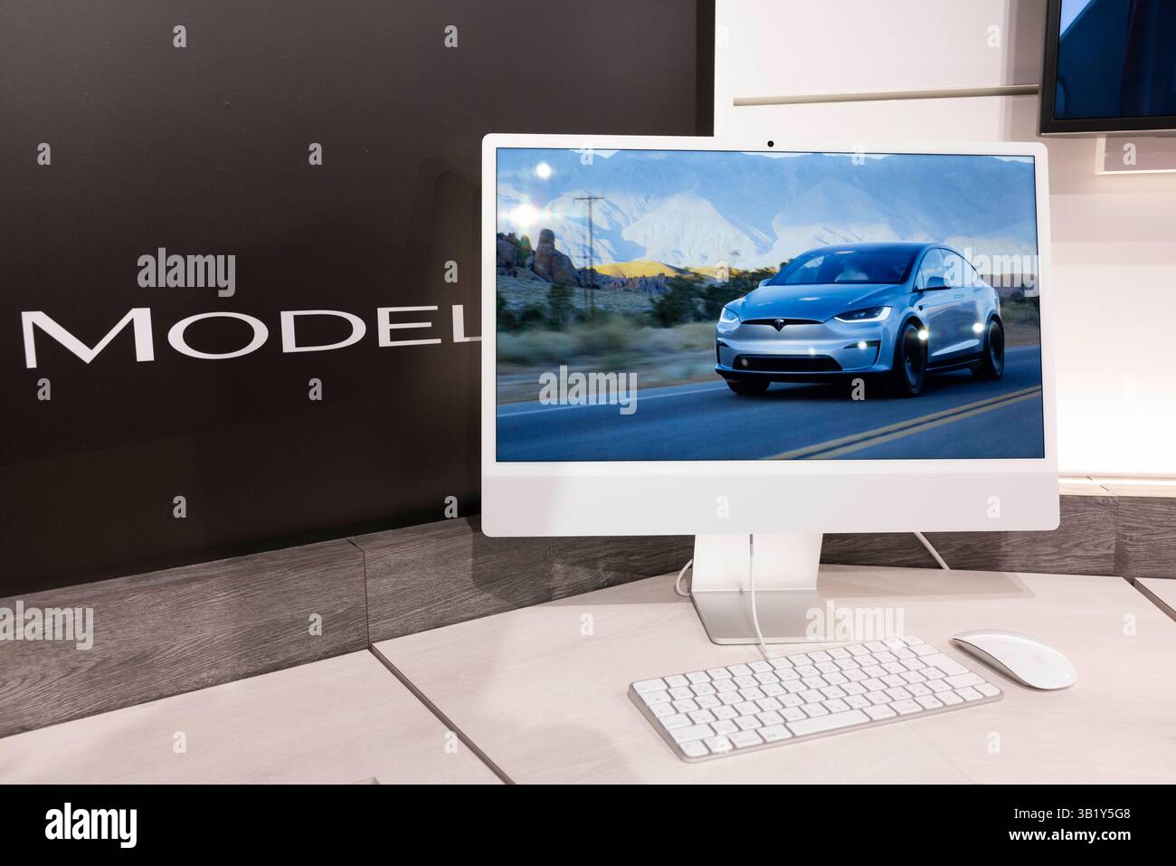 Tesla model 3 presentation runs on a PC inside a Tesla pop-up store in ...