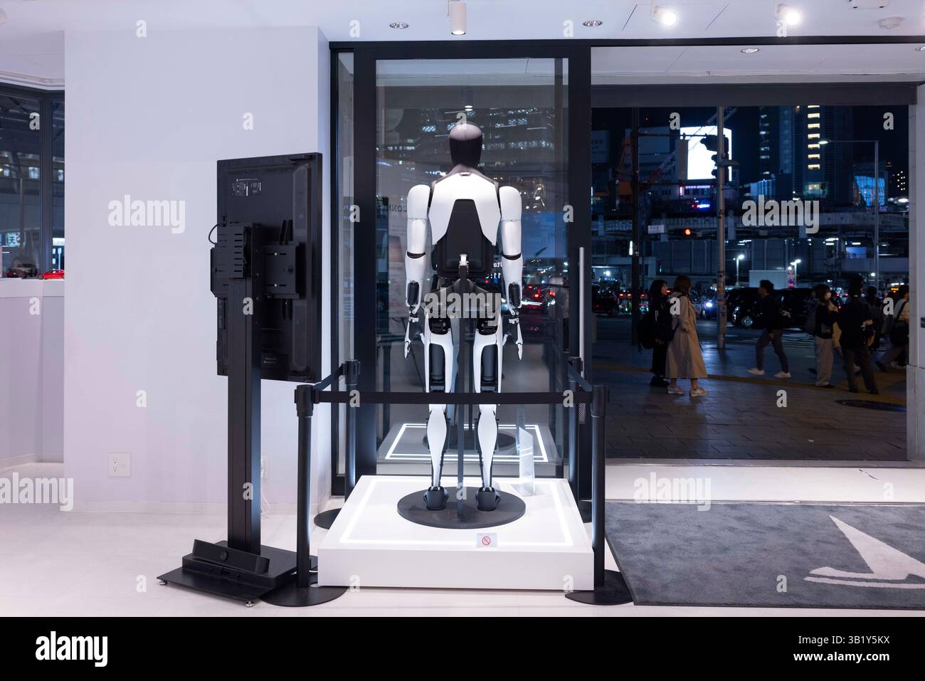 Tesla Optimus humanoid robot on display inside the Tesla pop-up store ...