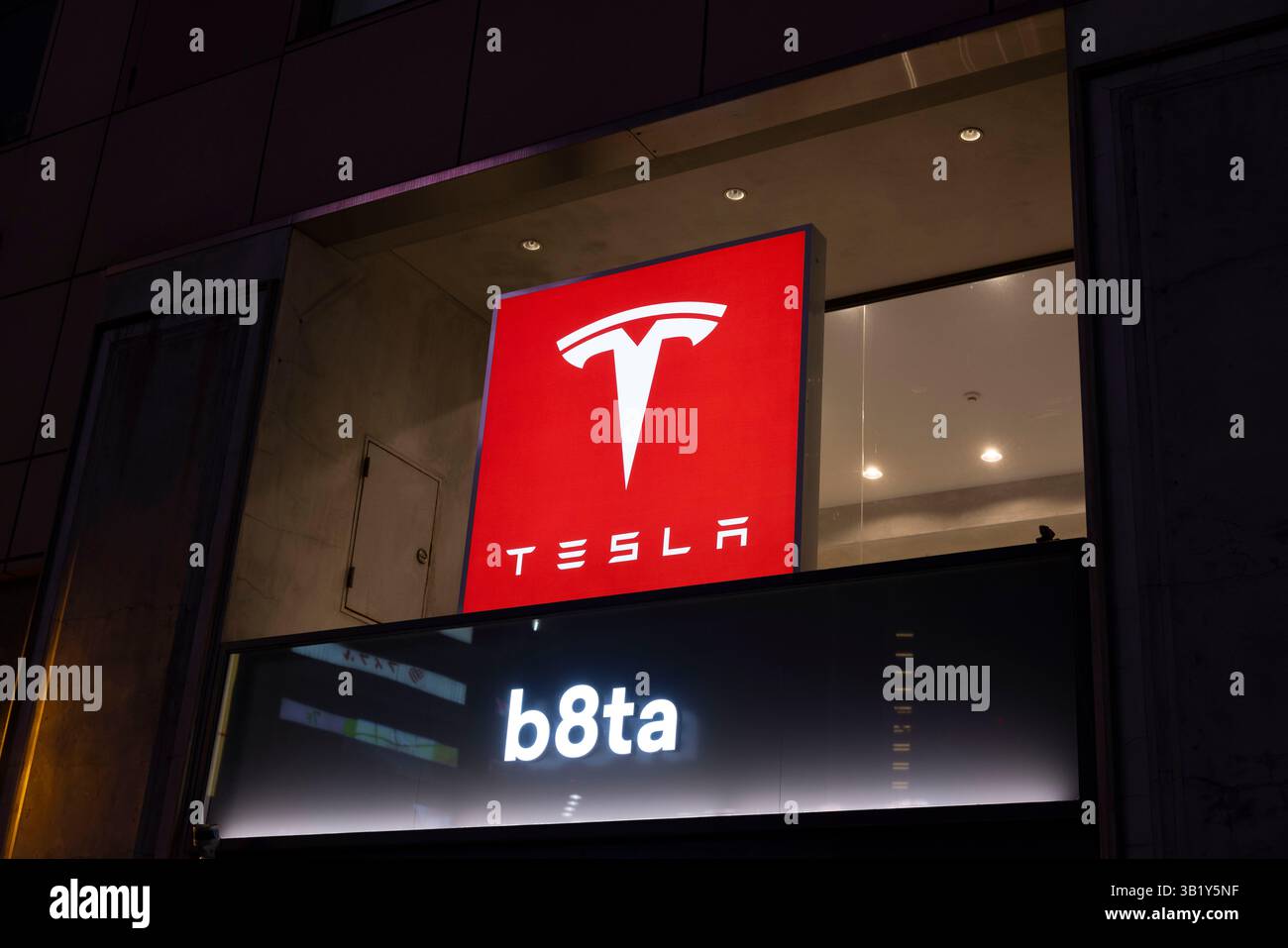 Tesla branding on a Tesla pop-up store near Shibuya crossing. In April ...