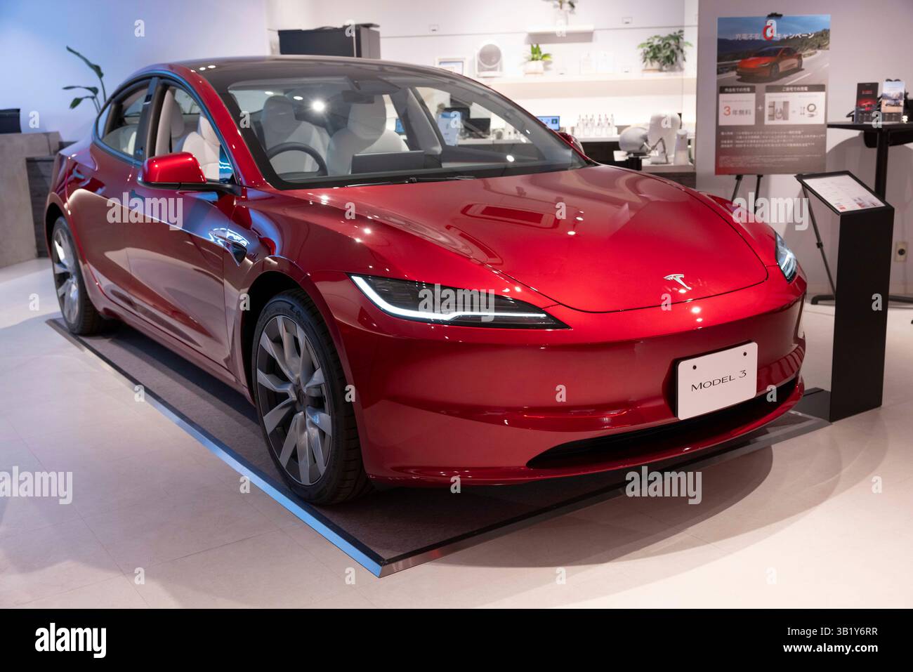 April 25, 2025, Japan: Tesla model 3 on display inside the Tesla pop-up ...