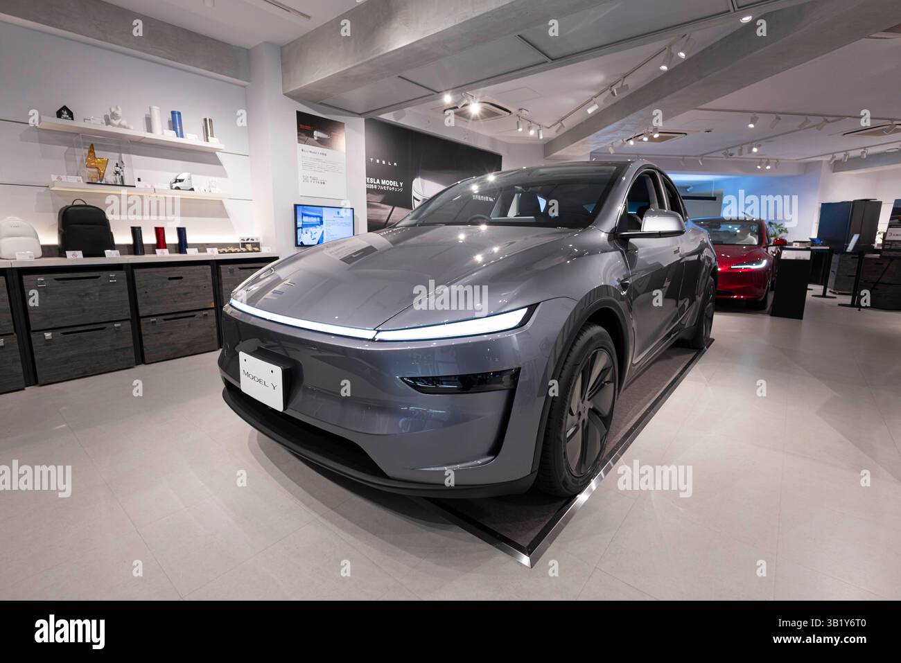 Japan. 25th Apr, 2025. Tesla model Y on display inside the Tesla pop-up ...