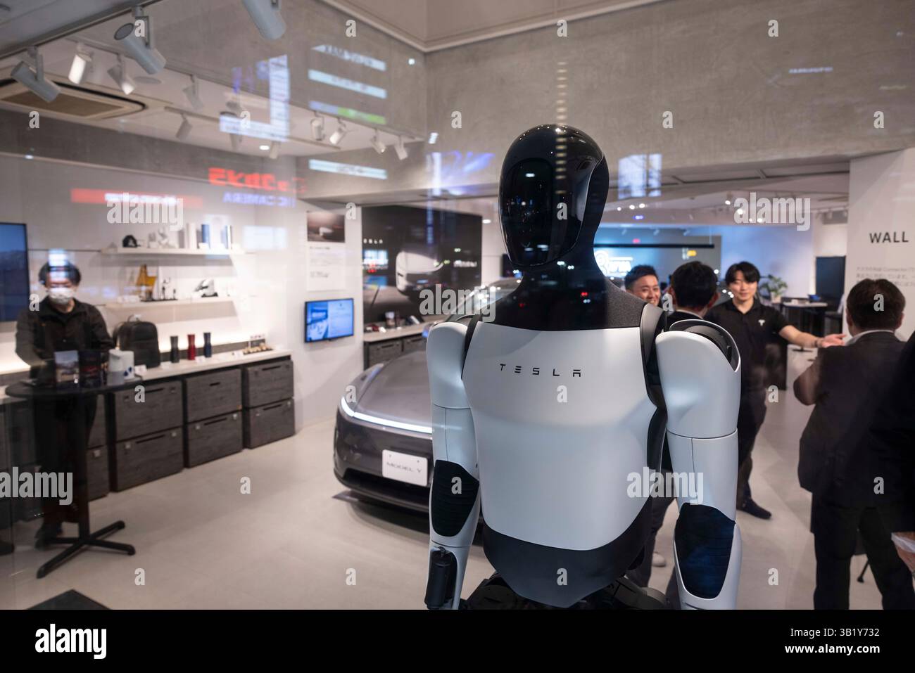 Japan. 25th Apr, 2025. Tesla Optimus humanoid robot on display inside ...