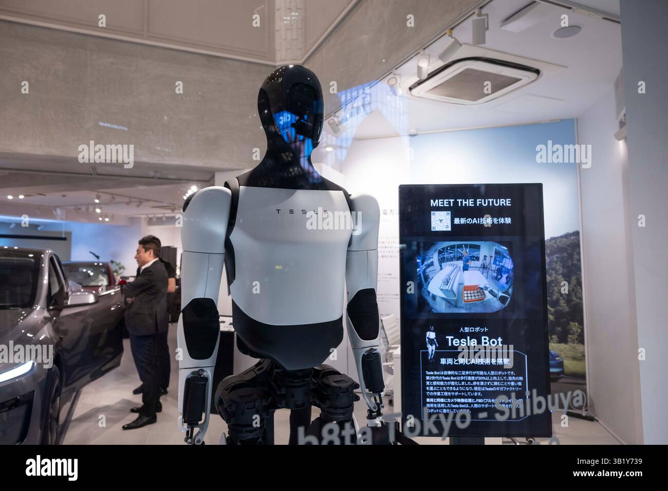 Japan. 25th Apr, 2025. Tesla Optimus humanoid robot on display inside ...