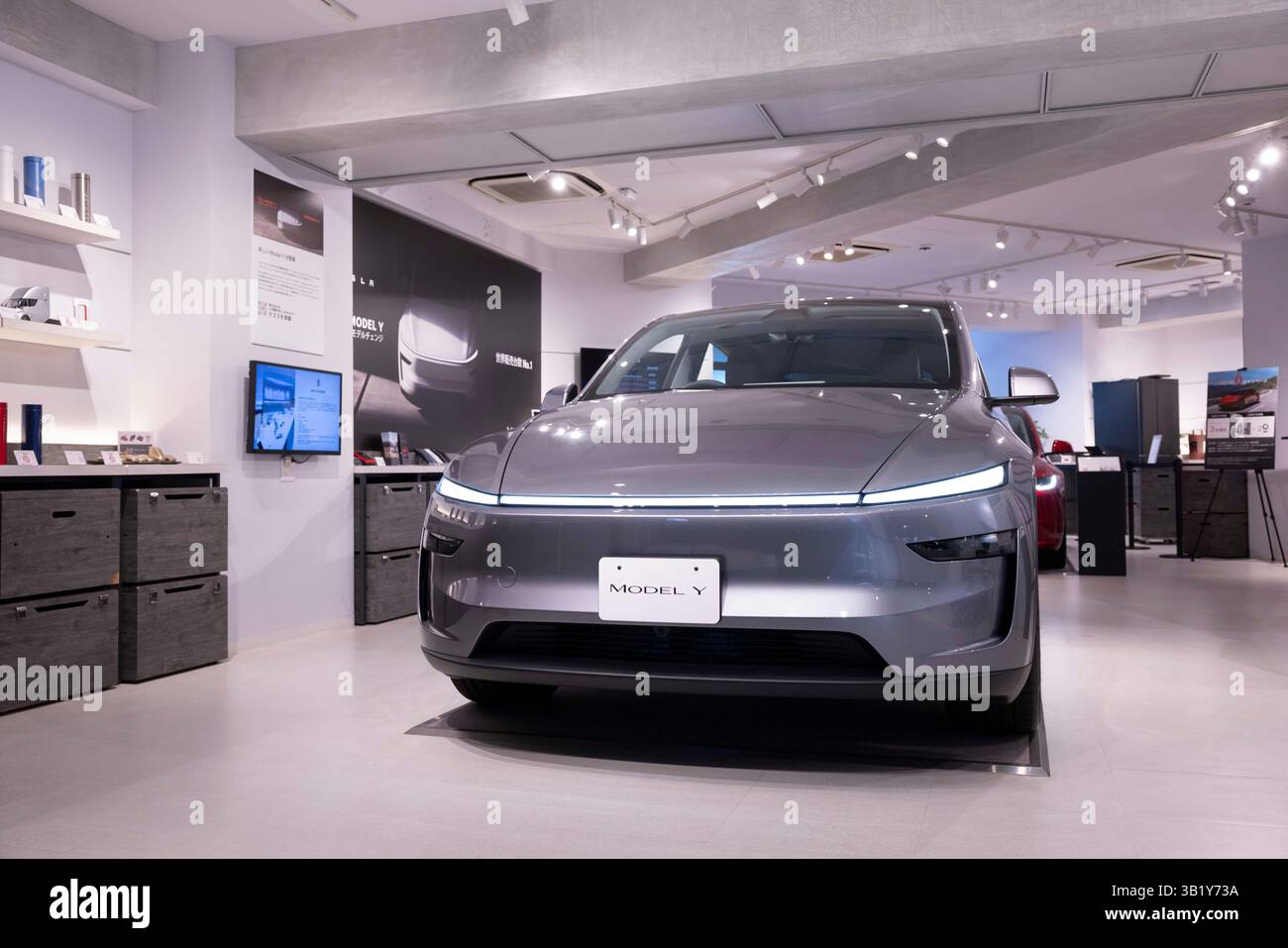 Japan. 25th Apr, 2025. Tesla model Y on display inside the Tesla pop-up ...