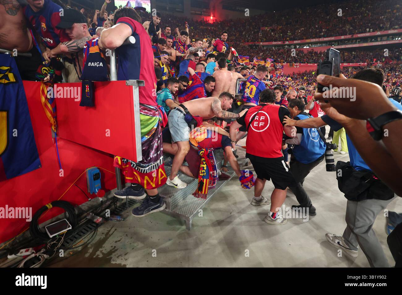 FC Barcelona supporters fall from the stands while celebrating the goal ...
