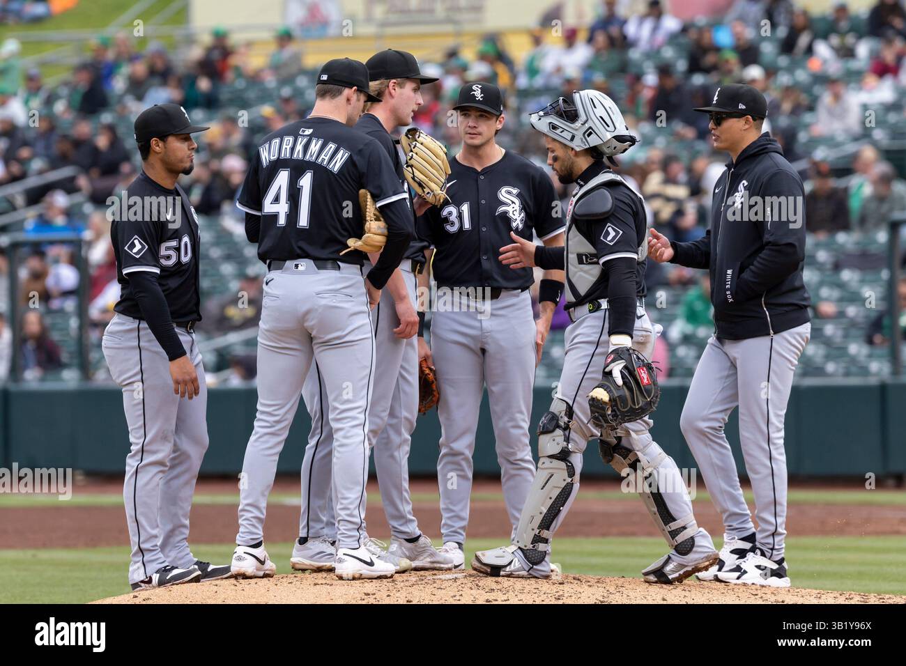 Chicago White Sox manager Will Venable, right, walks to the mound for a ...