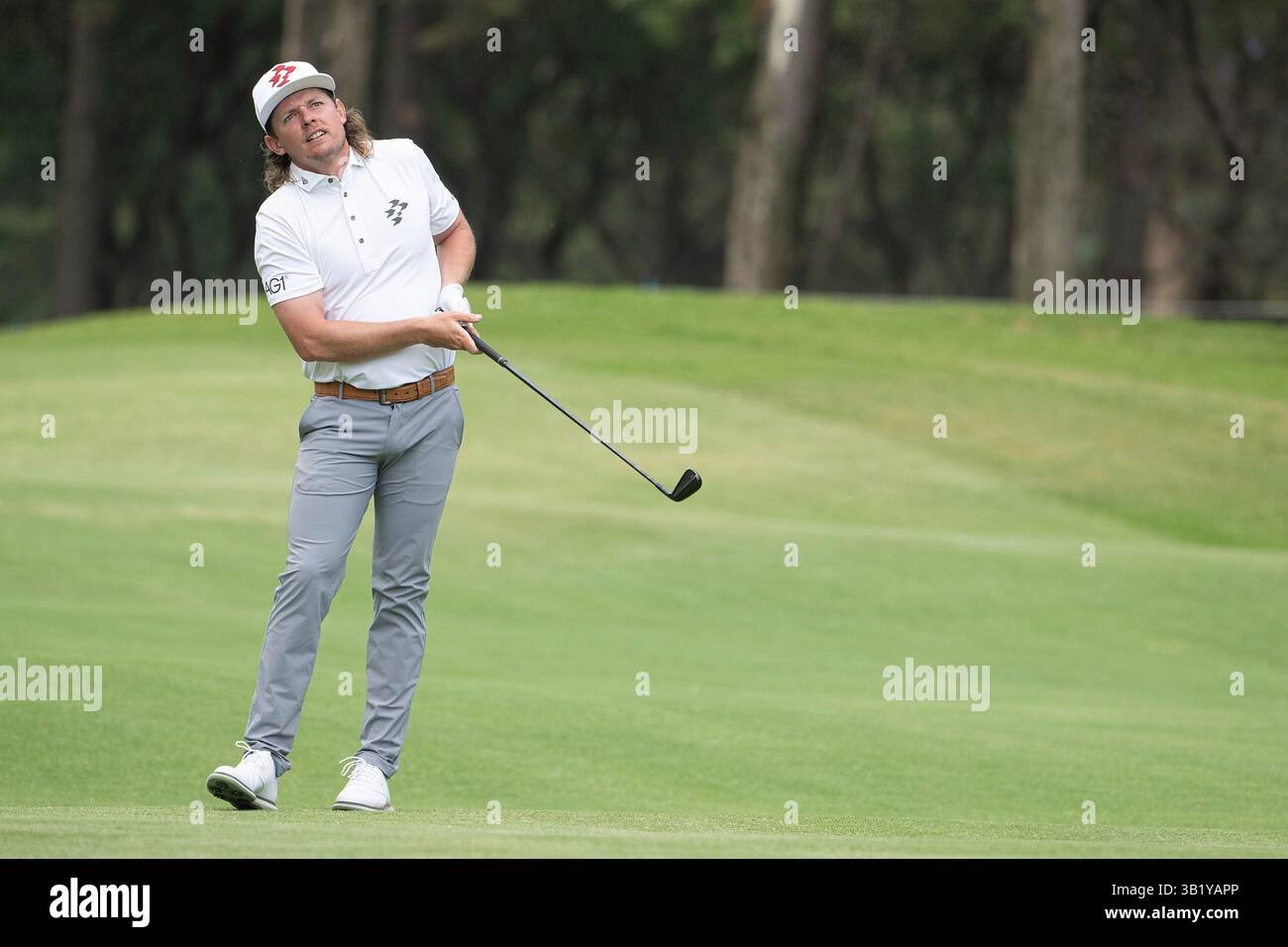 Captain Cameron Smith of Ripper GC hits his shot on the 16th hole ...