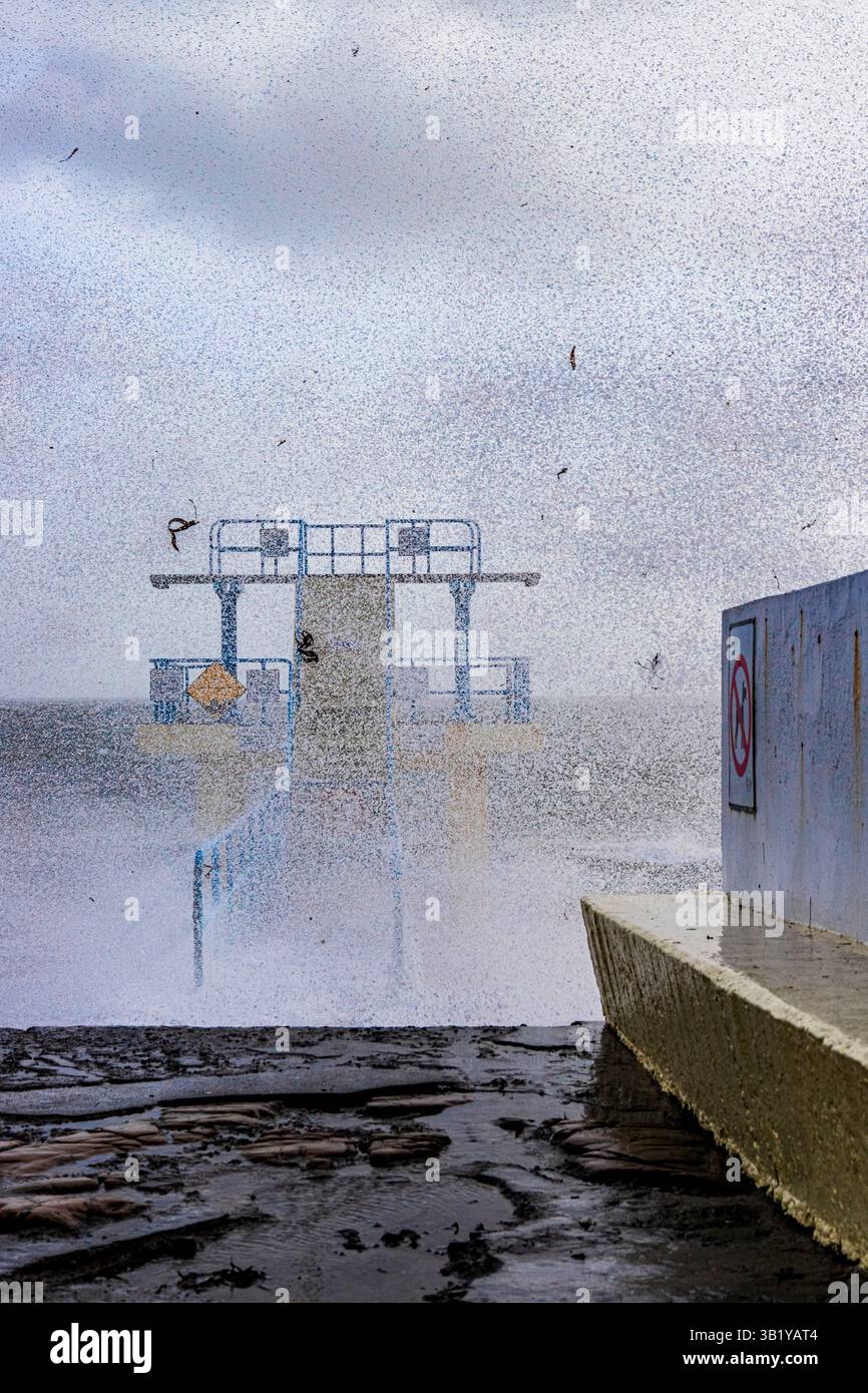Waves and spray at Blackrock tower during Storm Stock Photo - Alamy