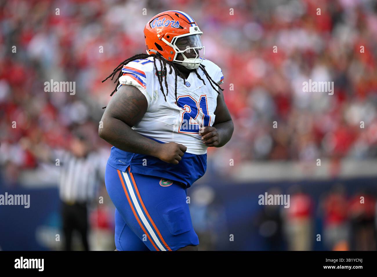 FILE - Florida defensive lineman Desmond Watson (21) runs off the field ...