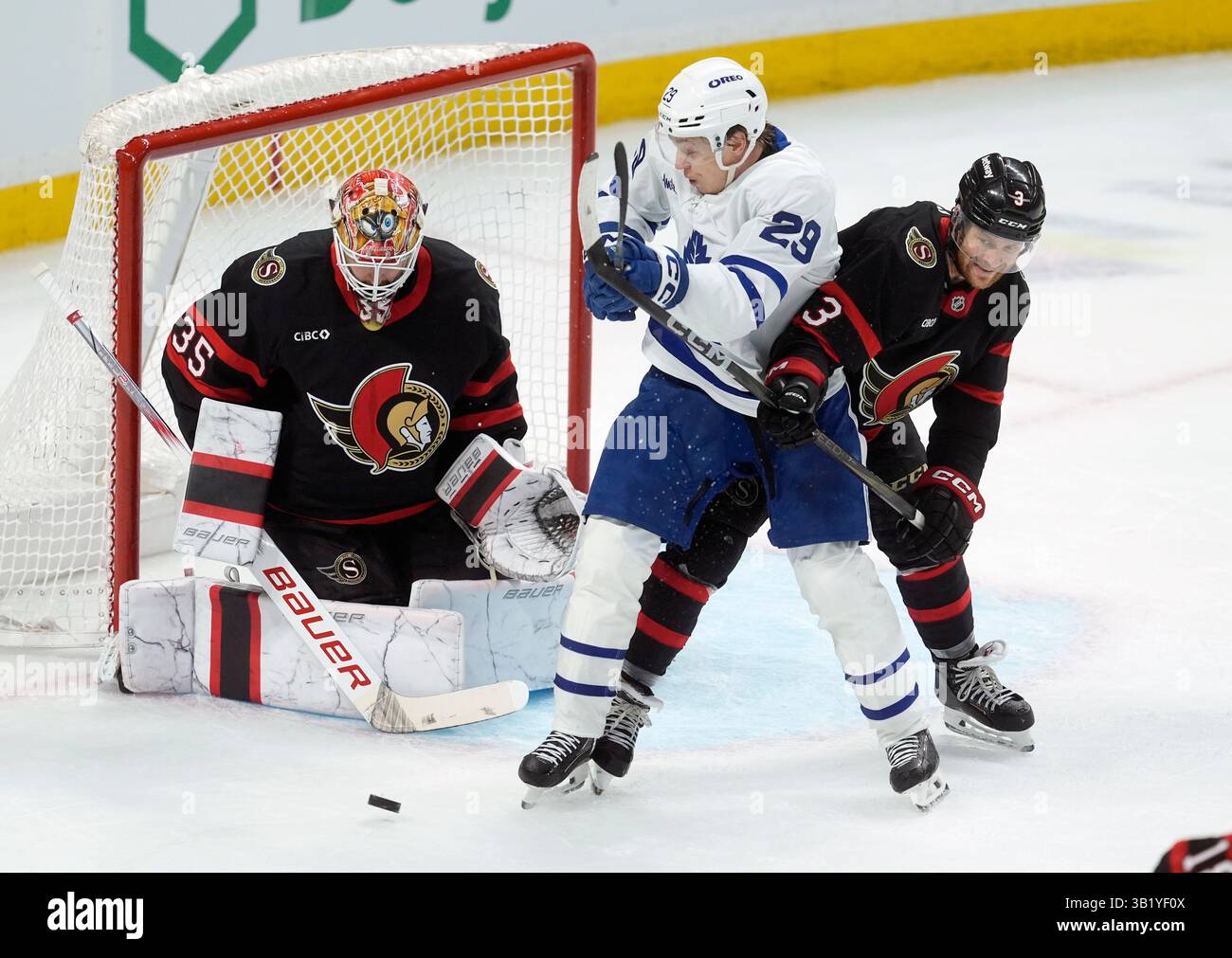 Ottawa Senators' Nick Jensen (3) lift the stick of Toronto Maple Leafs ...
