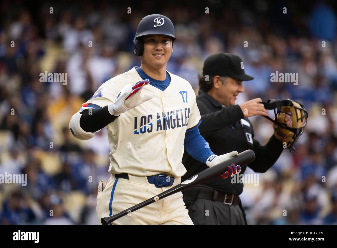 Los Angeles Dodgers' Shohei Ohtani waves towards the Pittsburgh Pirates ...