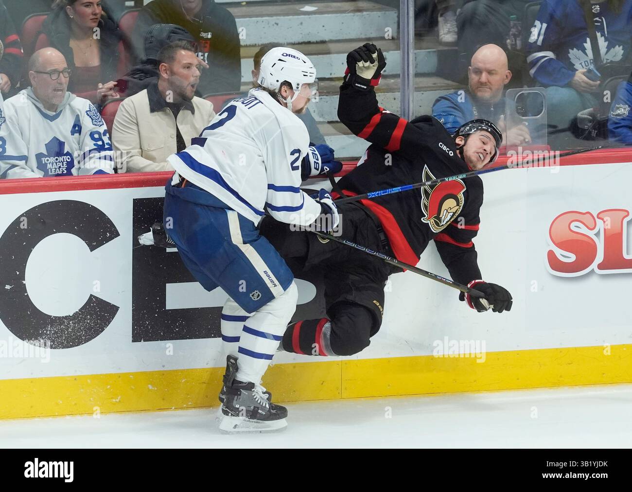 Toronto Maple Leafs' Simon Benoit (2) collides with Ottawa Senators ...