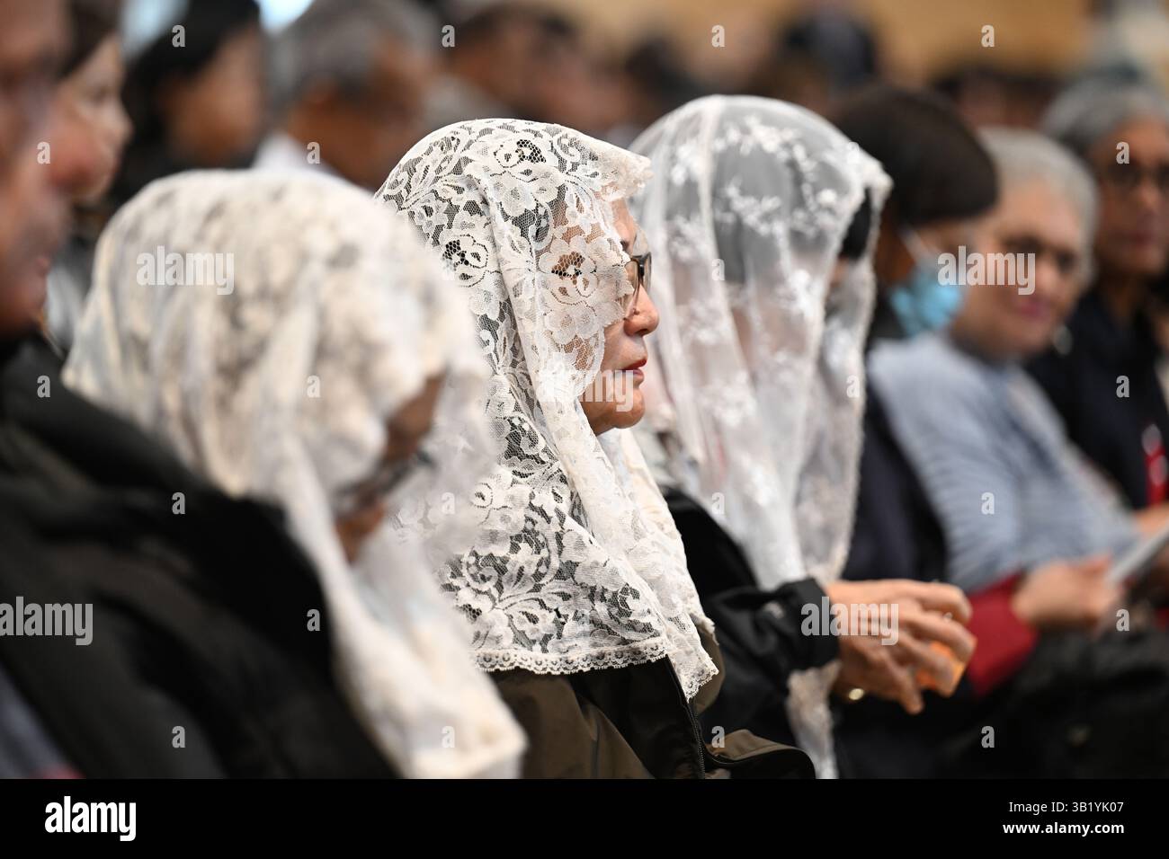 Parishioners attend a solemn Mass for the repose of the soul of Pope ...