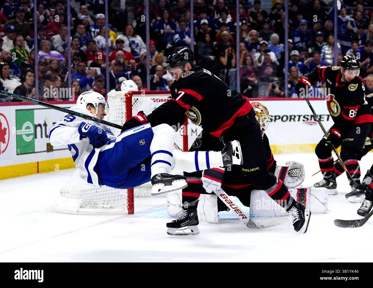 Ottawa Senators' Brady Tkachuk (7) knocks Toronto Maple Leafs' Pontus ...
