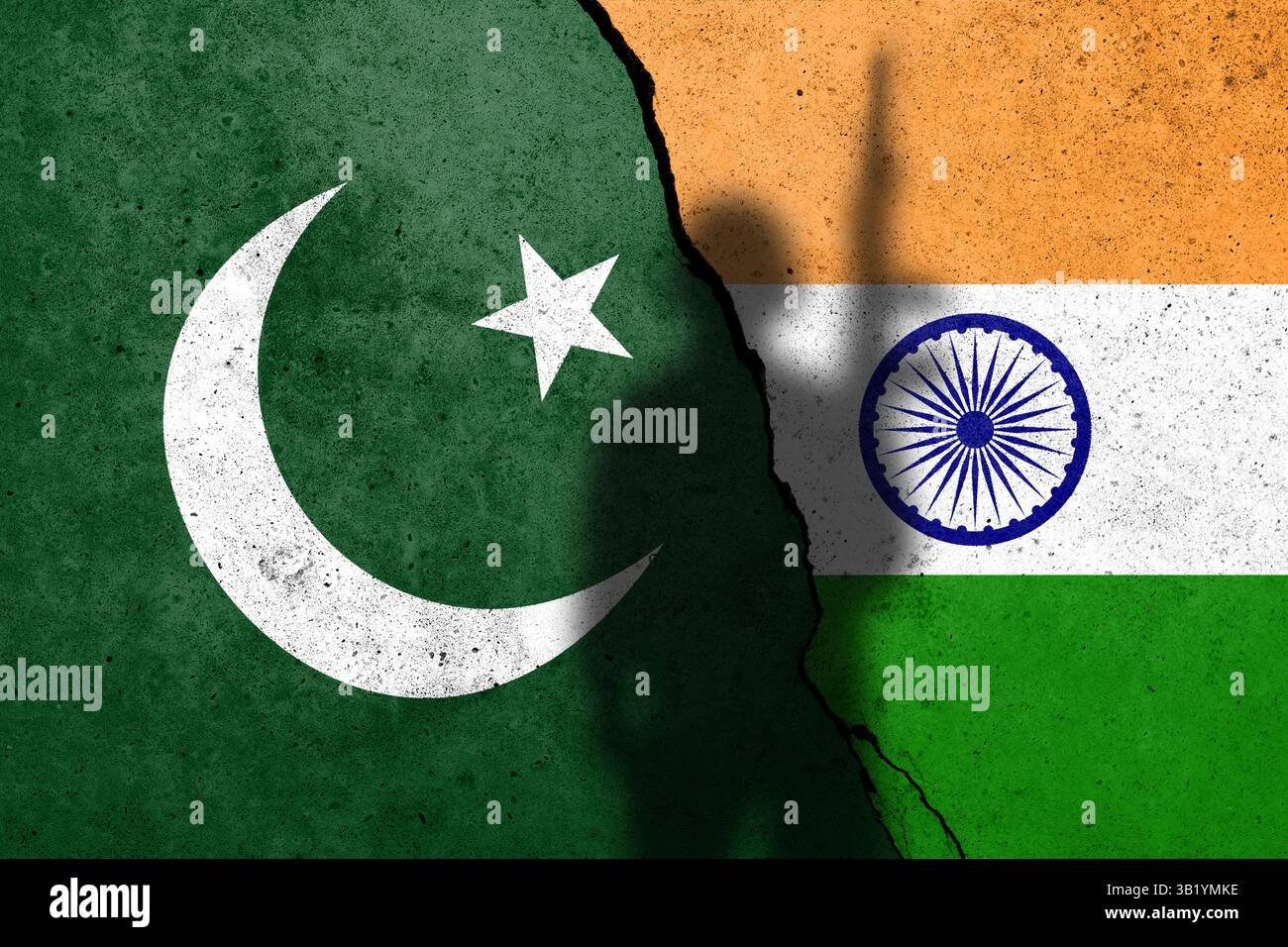 Flags of Pakistan and India painted on the concrete wall with soldier ...