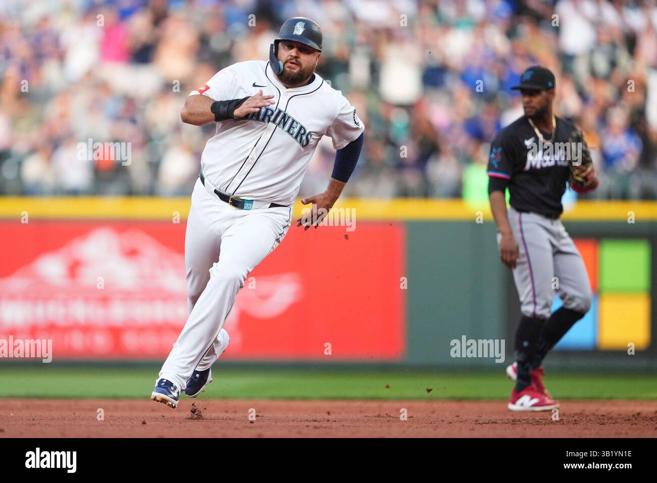 Seattle Mariners' Rowdy Tellez runs to third base on a two-run double ...