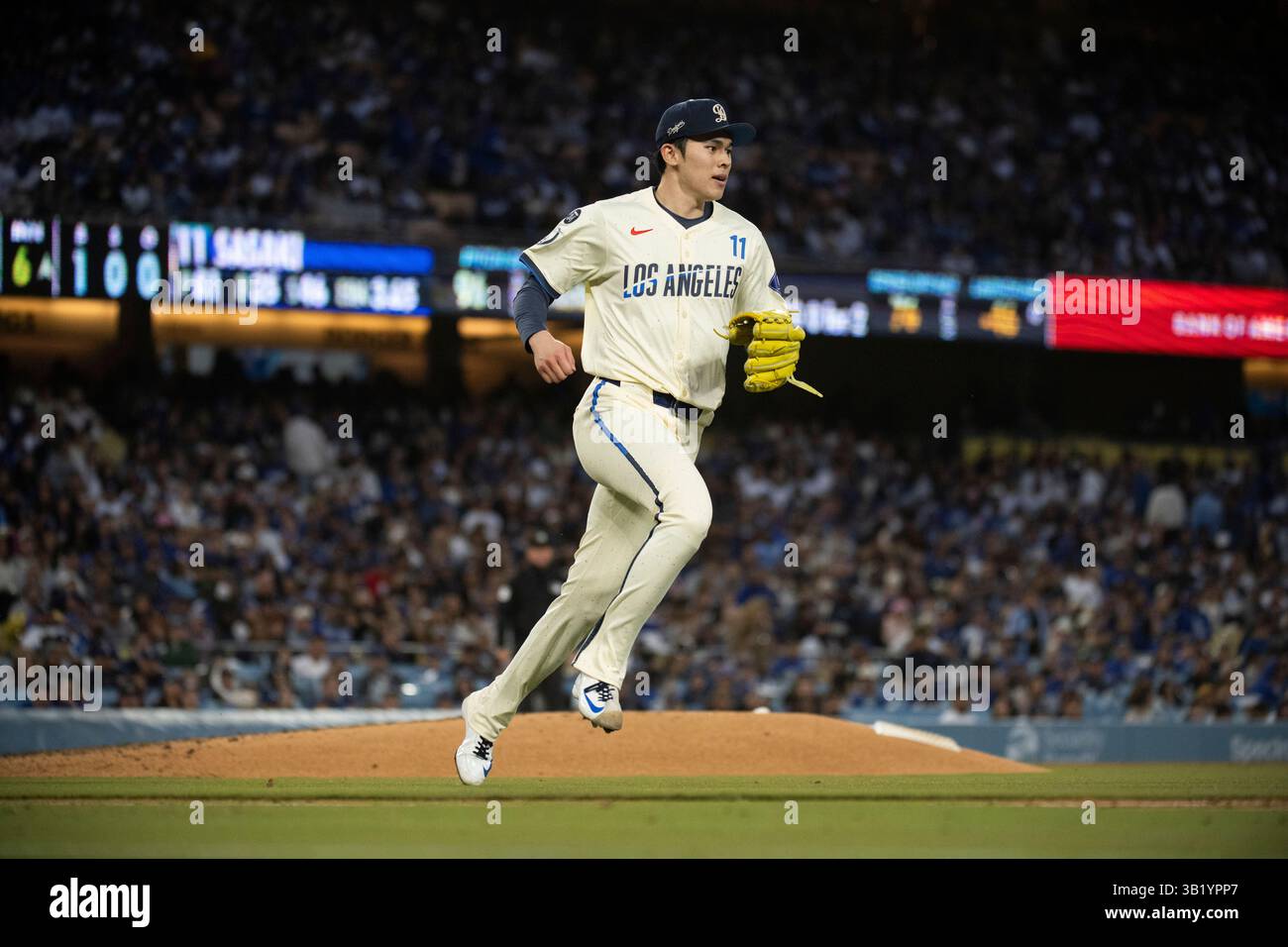 Los Angeles Dodgers starting pitcher Roki Sasaki runs during the sixth ...