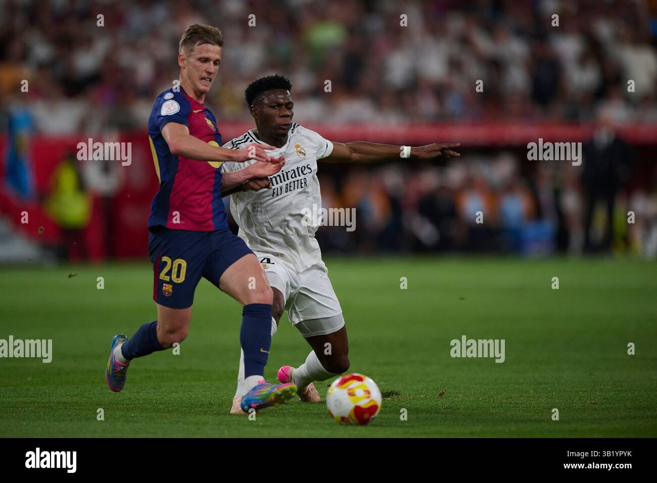 Seville, Spain. 26th Apr, 2025. Dani Olmo (L) of FC Barcelona vies with ...