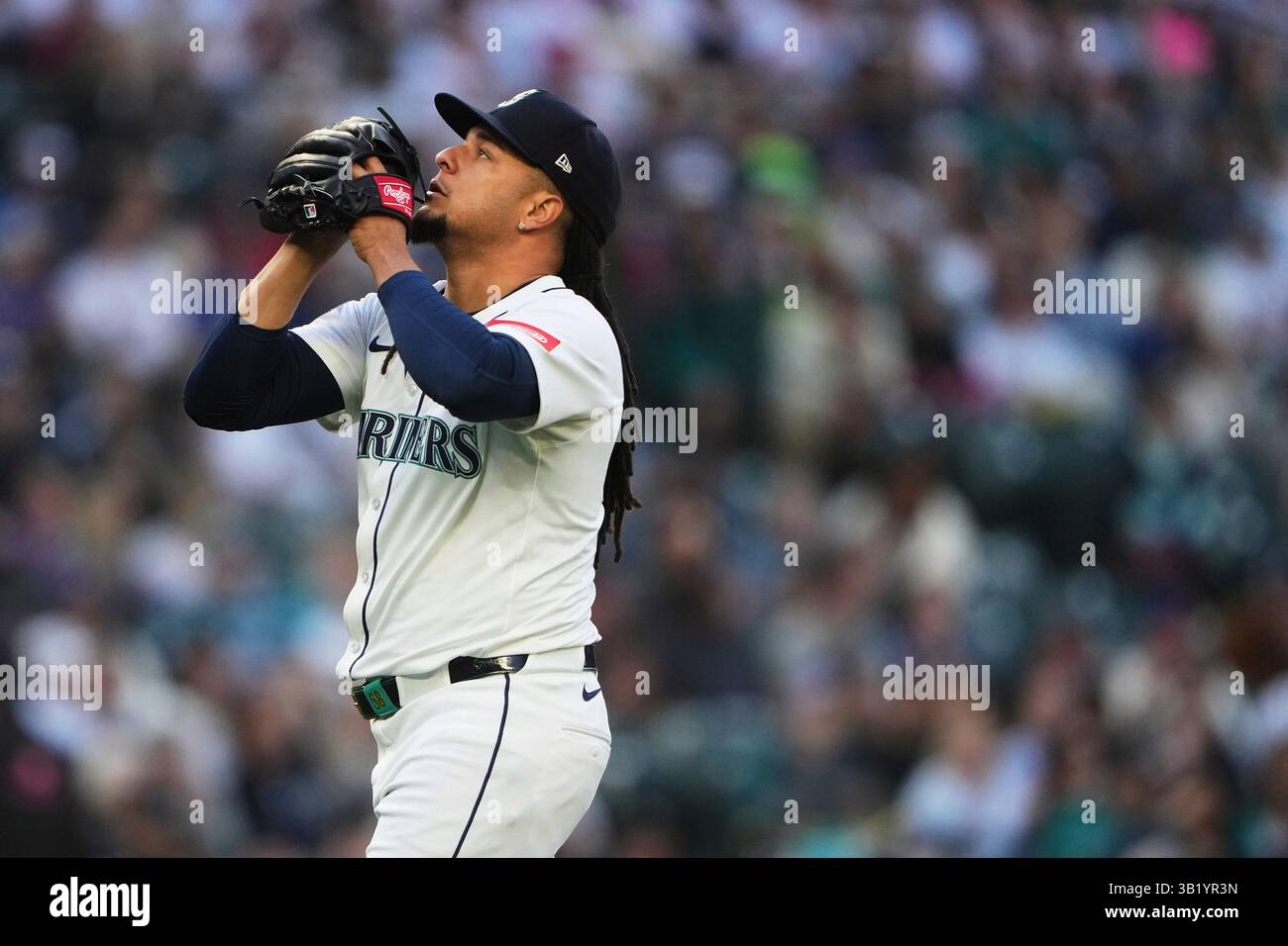Seattle Mariners starting pitcher Luis Castillo walks back to the ...