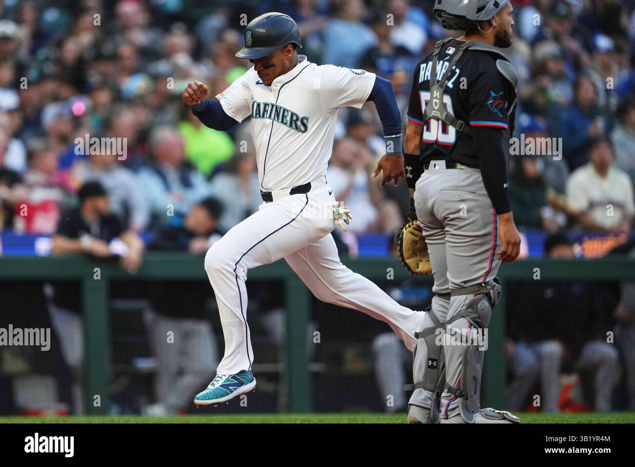 Seattle Mariners' Jorge Polanco scores on a sacrifice fly by Luke Raley ...