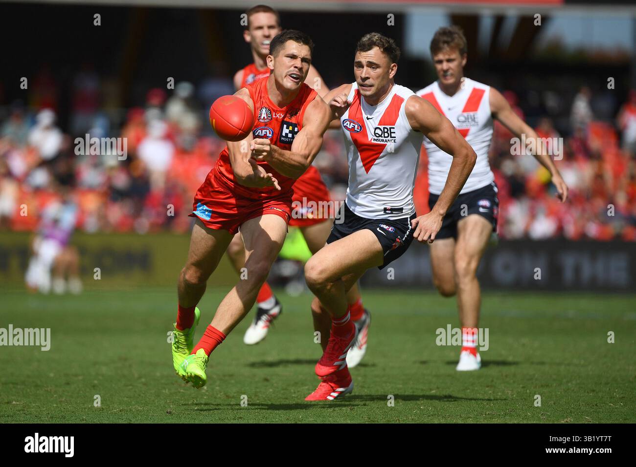 Gold Coast, Australia. 27th Apr, 2025. Ben Ainsworth of the Suns handballs during the AFL Round ...