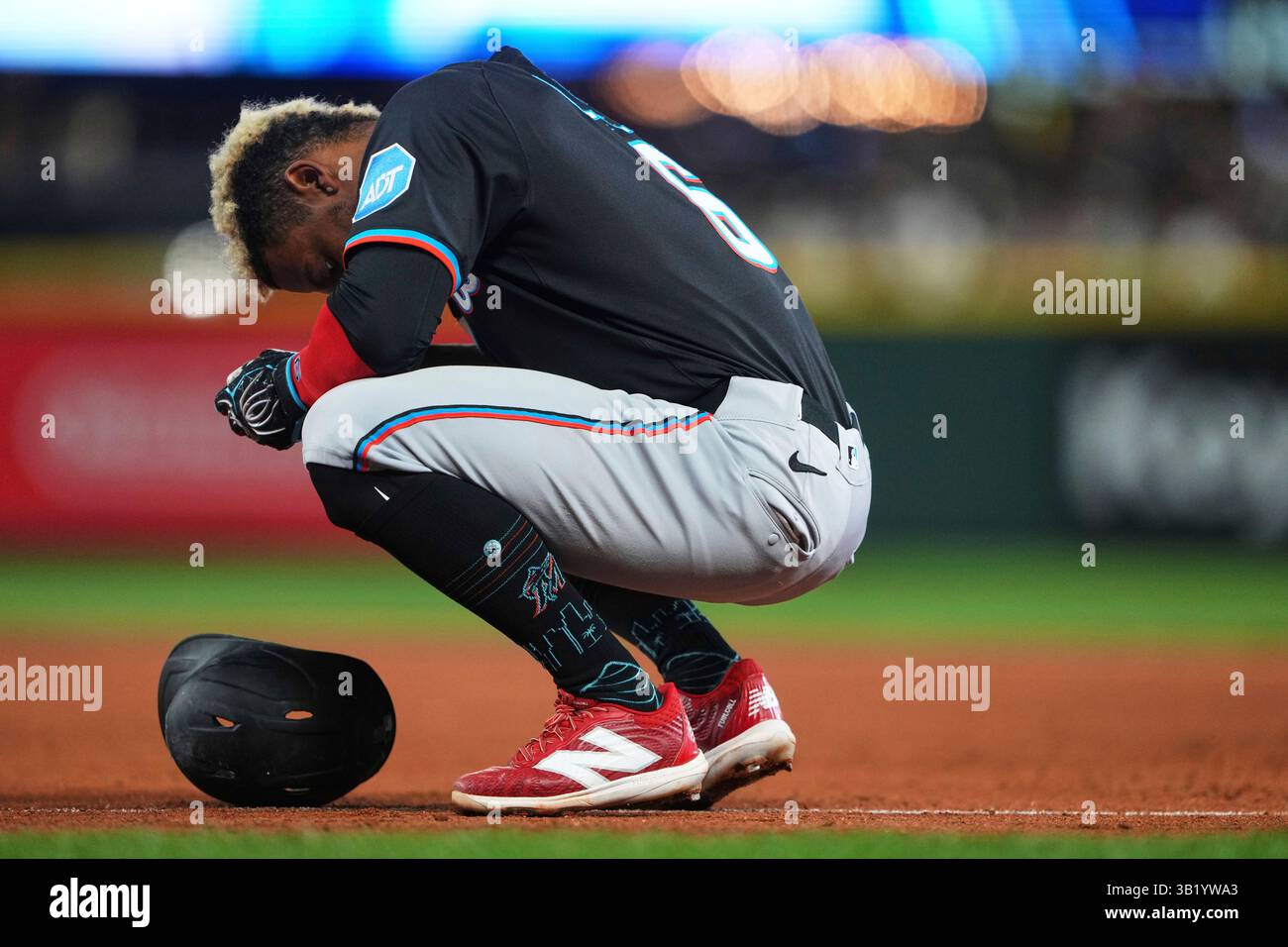 Miami Marlins' Otto Lopez looks down after grounding into a double play ...