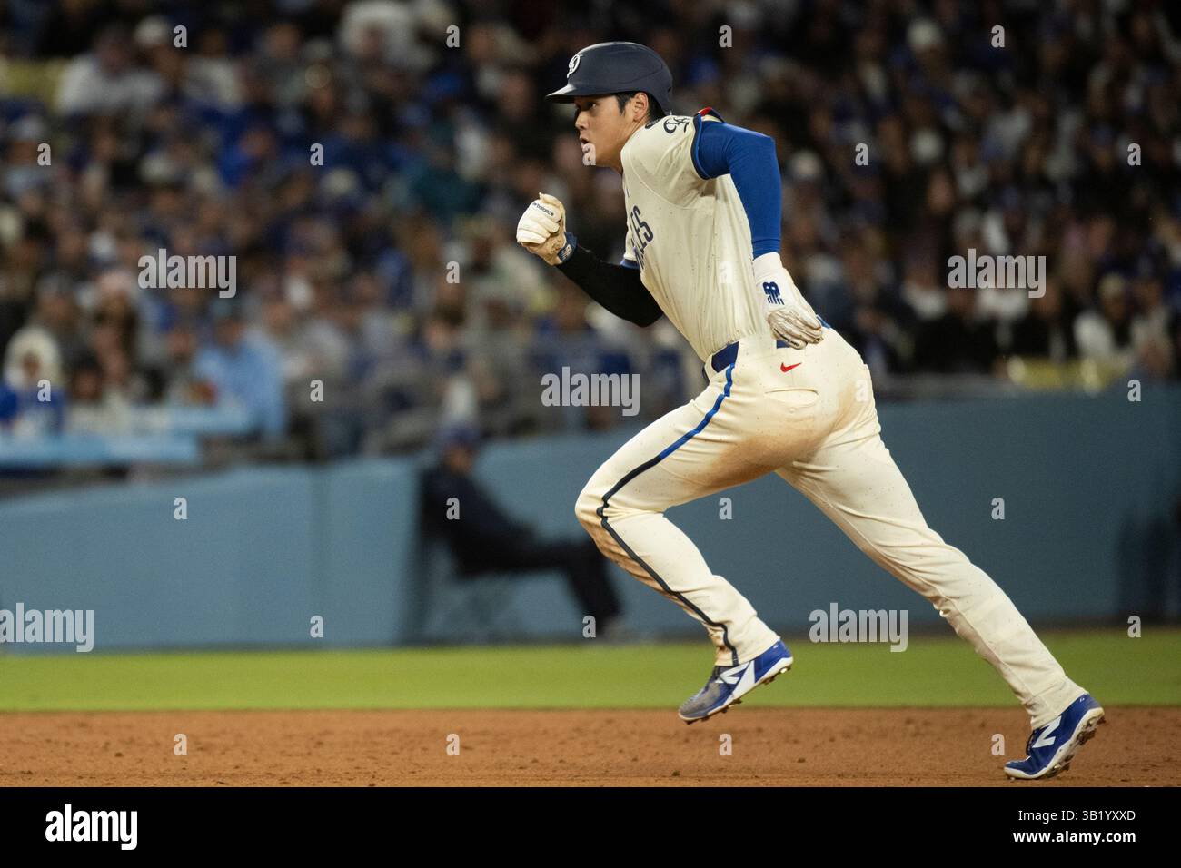 Los Angeles Dodgers' Shohei Ohtani runs to steal third base during the ...
