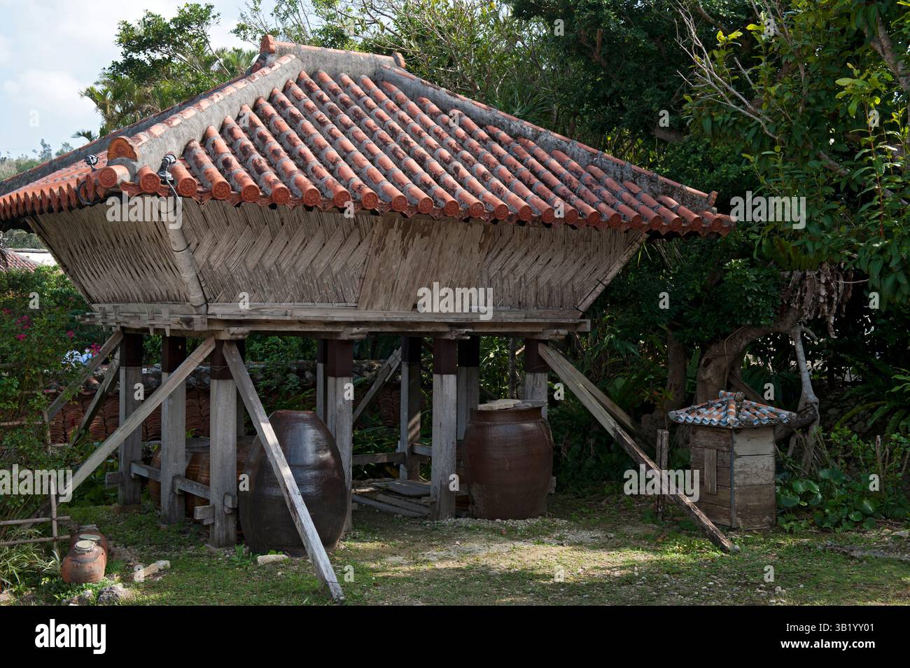Traditional elevated Okinawan food storehouse with ceramic storage ...