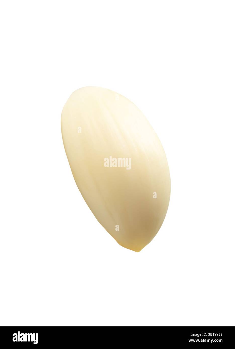 Side view of single peeled garlic clove or piece is isolated on white ...