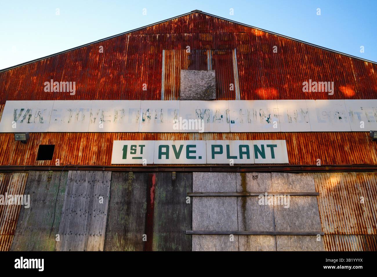A rusted tin public works building along 1st Avenue in Olympic Village ...