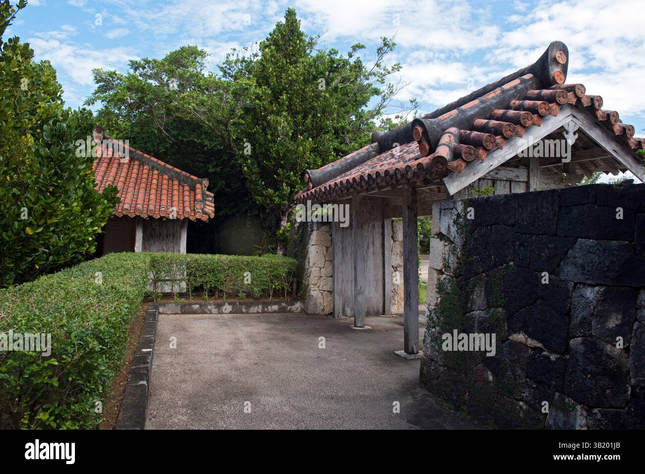 A historic wooden gate with ceramic tile roof marks the entrance to the ...