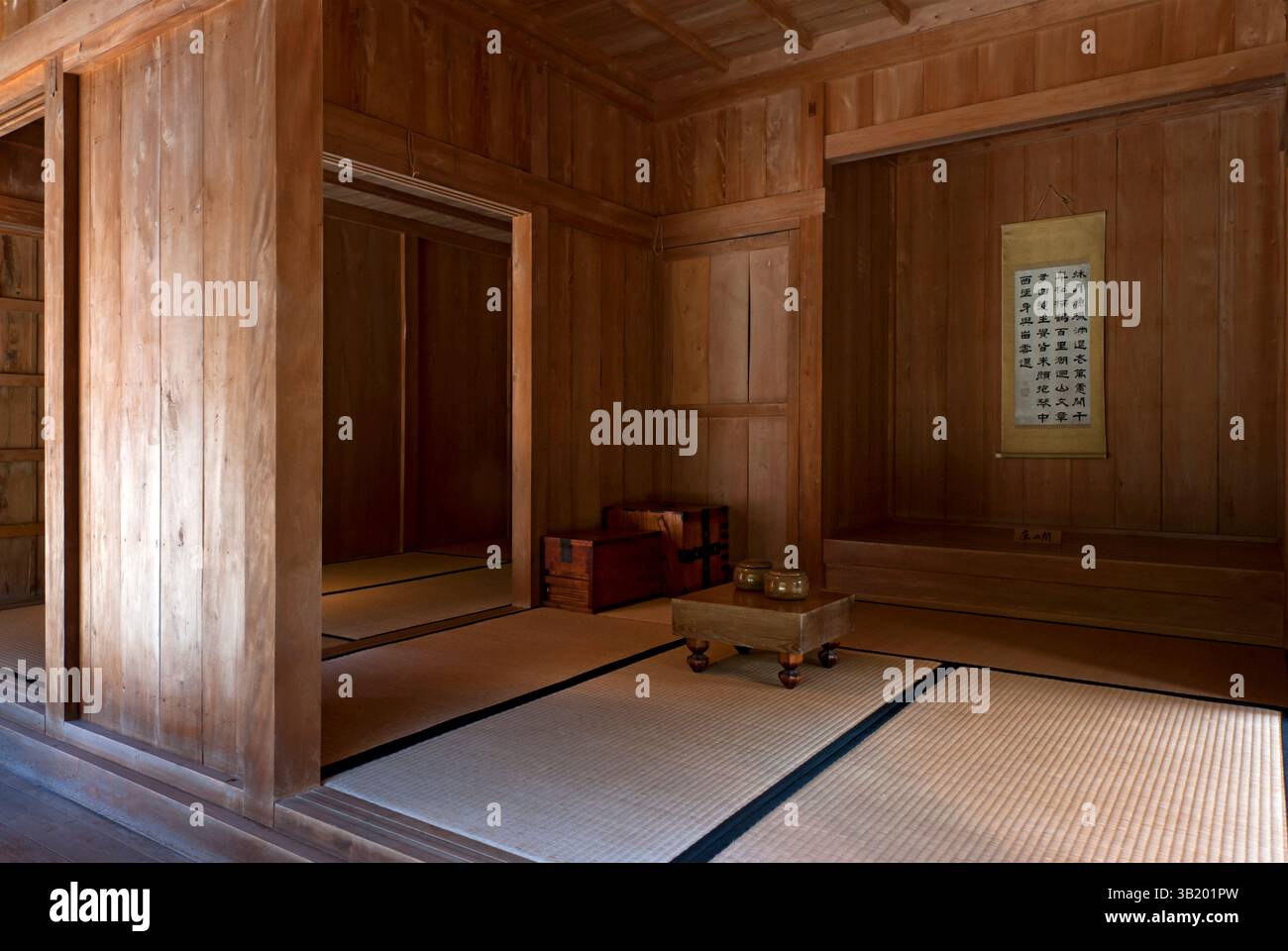 Hanging scroll in tokonoma alcove, go game board and shoji screen with ...