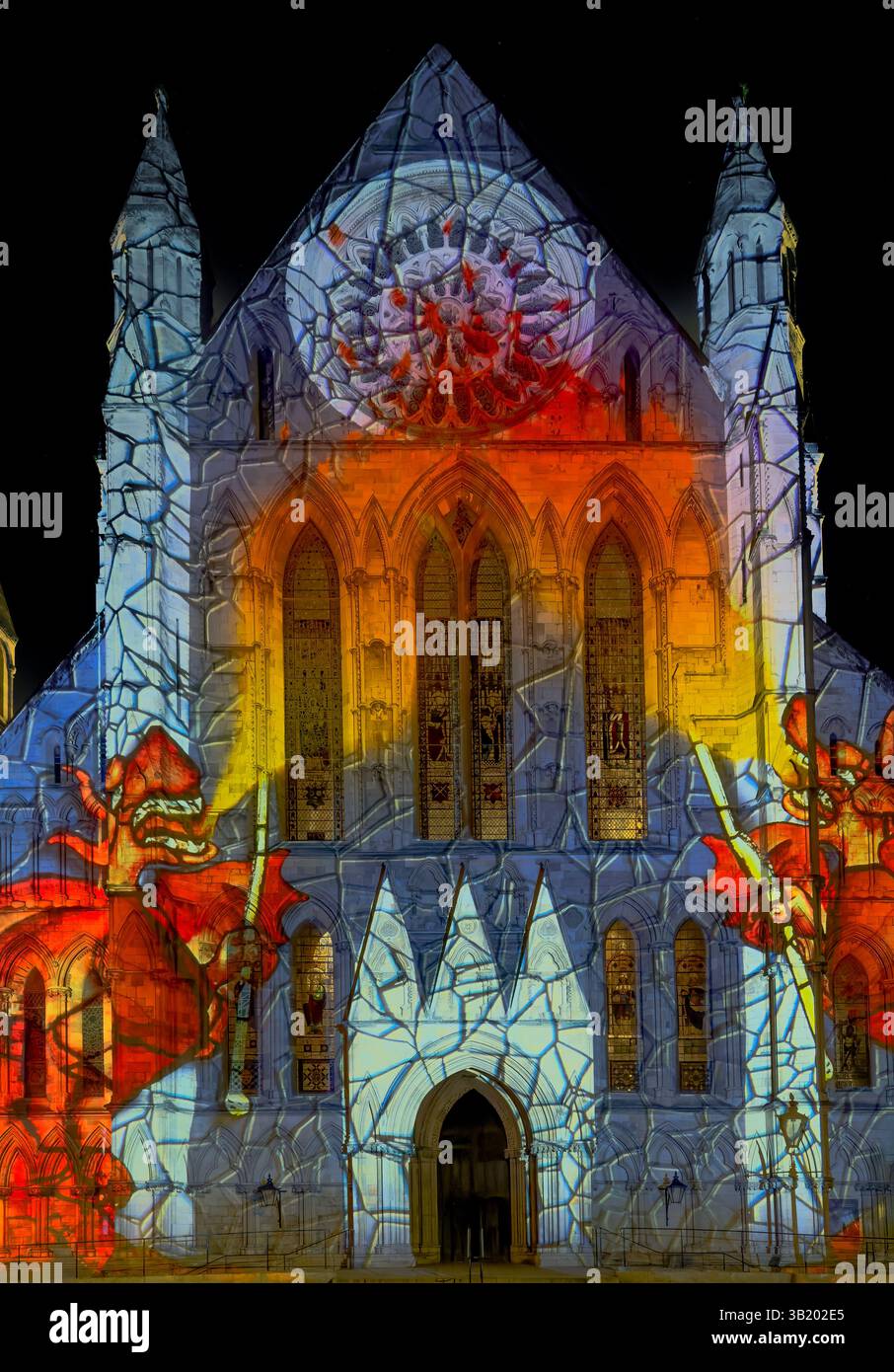 Illuminated projection of mythical dragons and stained-glass imagery on ...