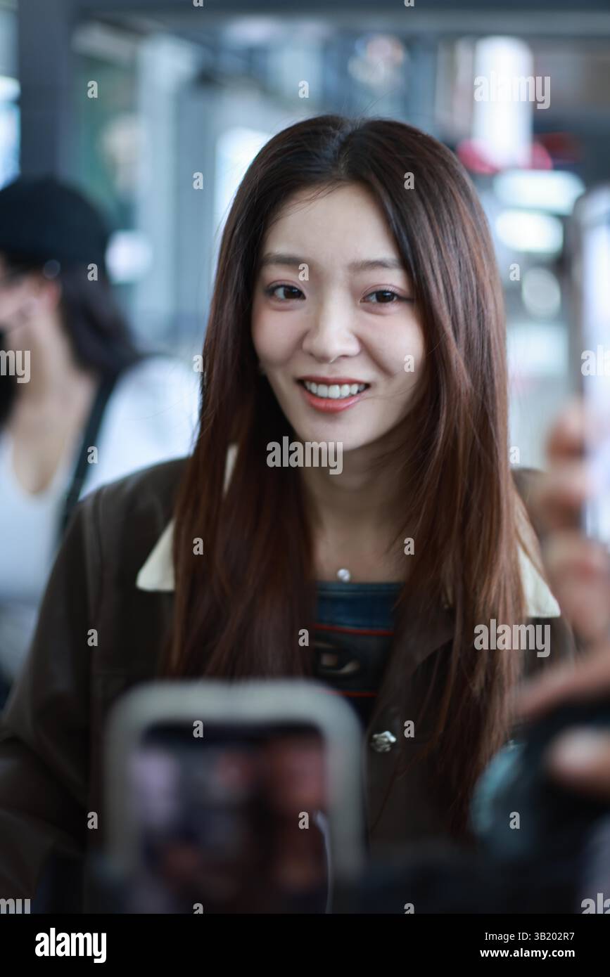 Chinese actress Luo Yutong appears at the airport in Shanghai, China ...
