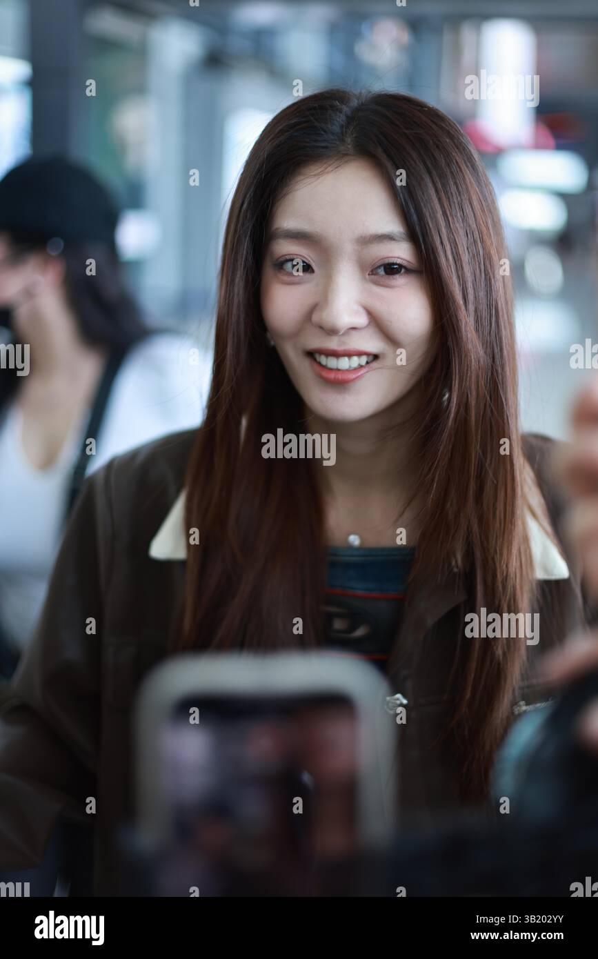 Chinese actress Luo Yutong appears at the airport in Shanghai, China ...