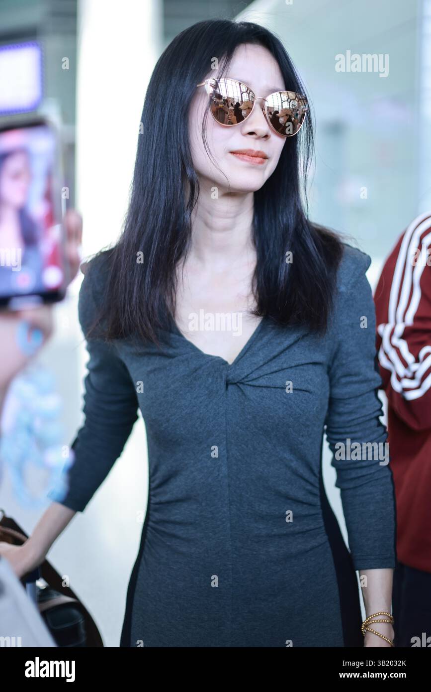 Chinese actress Ni Hongjie appears at the airport in Shanghai, China ...