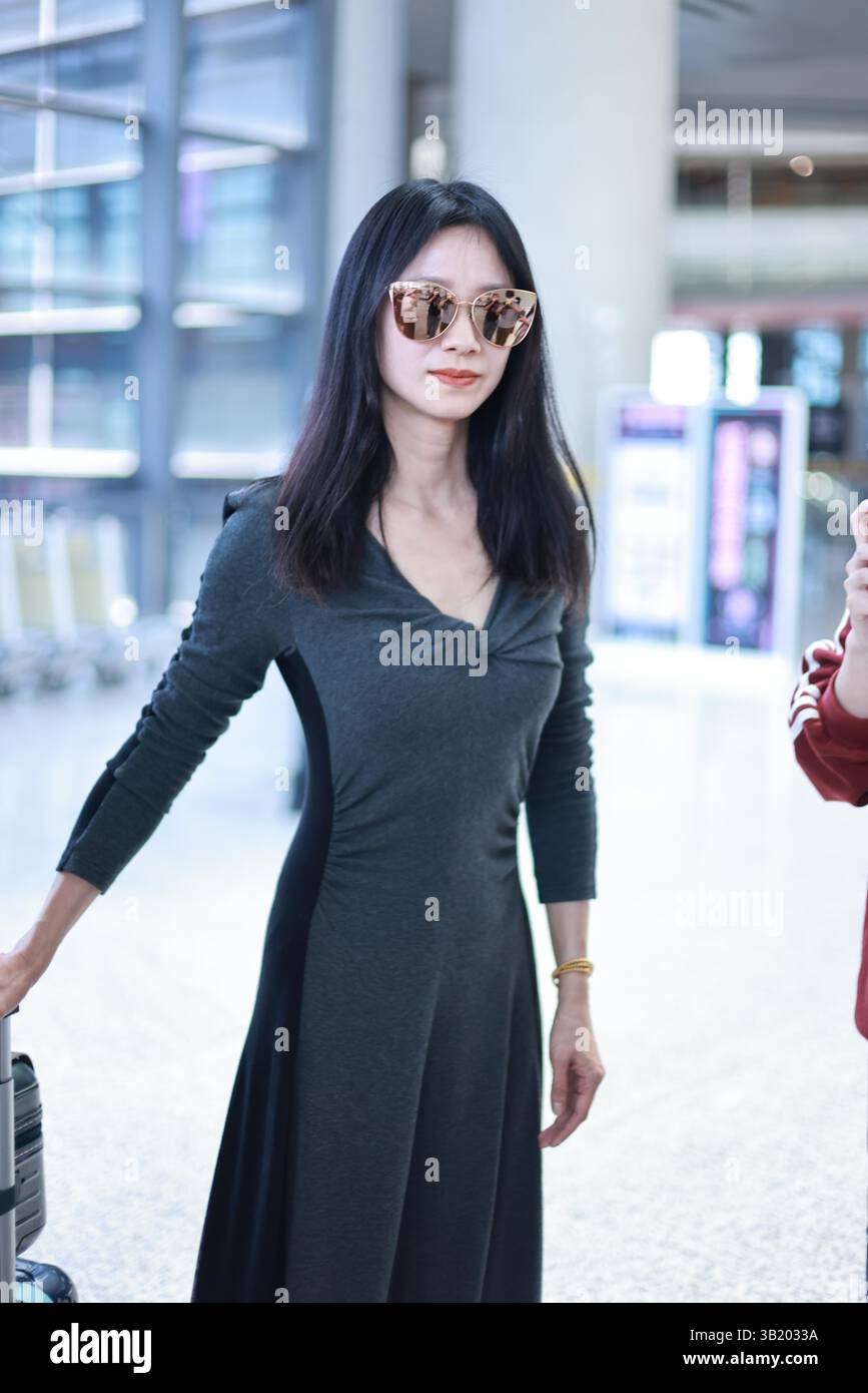 Chinese actress Ni Hongjie appears at the airport in Shanghai, China ...