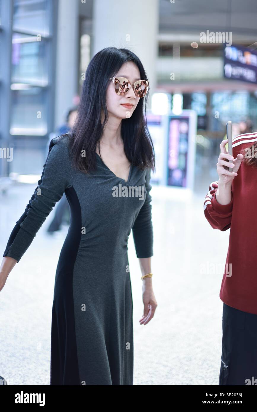 Chinese actress Ni Hongjie appears at the airport in Shanghai, China ...