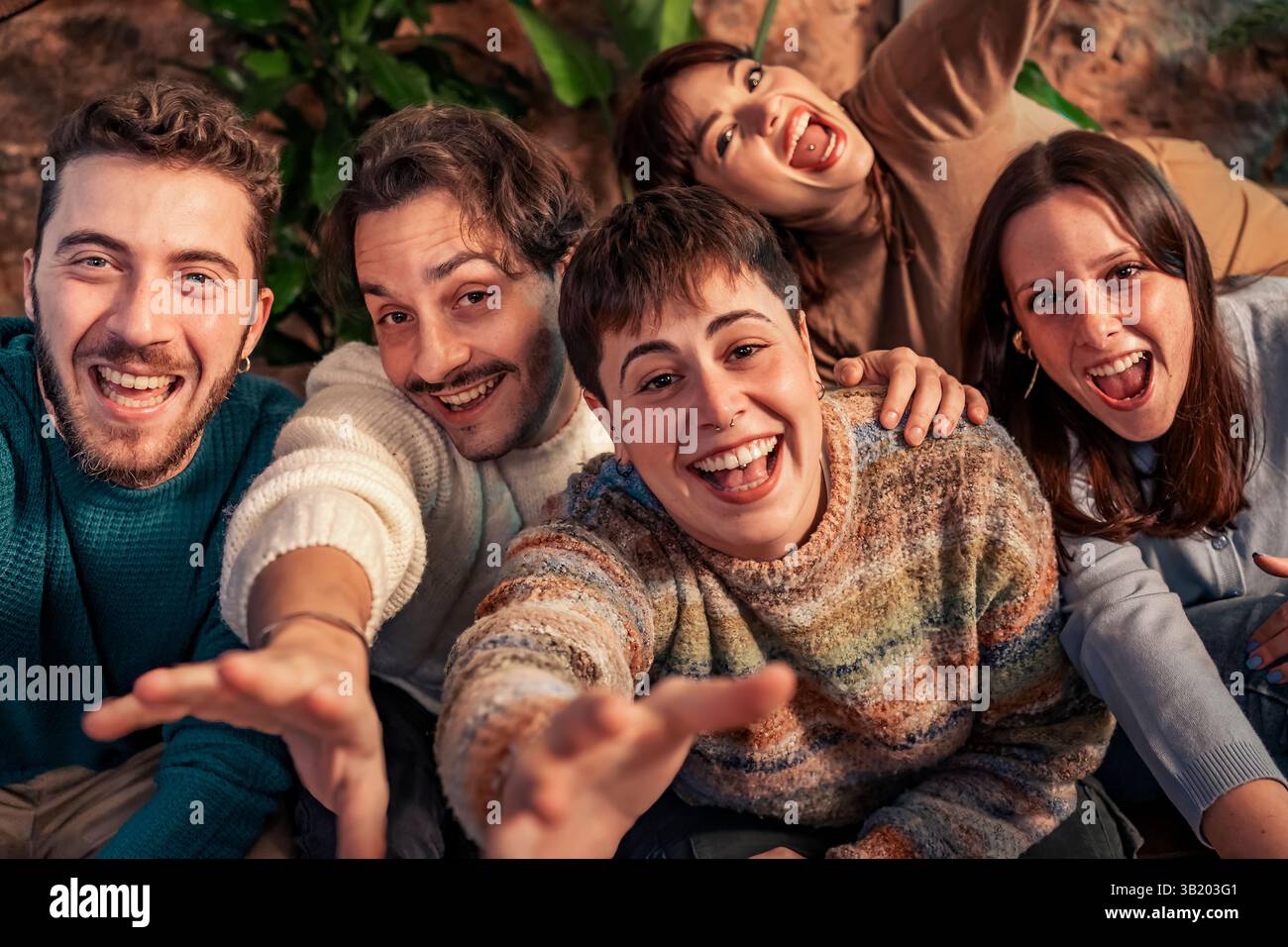 Happy diverse friends taking a selfie and laughing together. Concept of ...