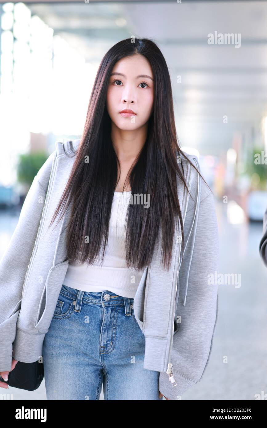 Chinese singer, dancer, and actress Sun Rui appears at the airport in ...