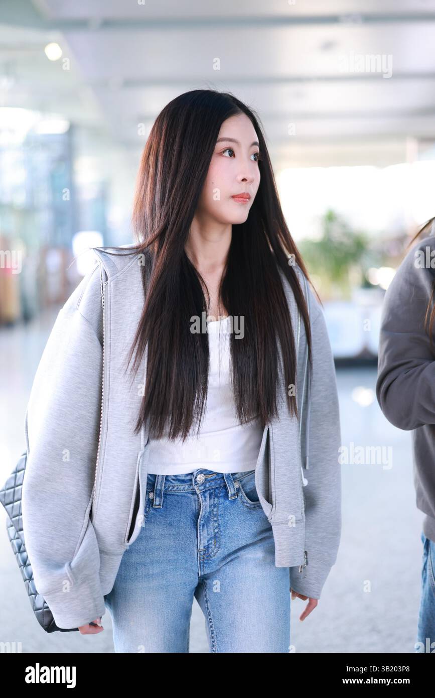 Chinese singer, dancer, and actress Sun Rui appears at the airport in ...