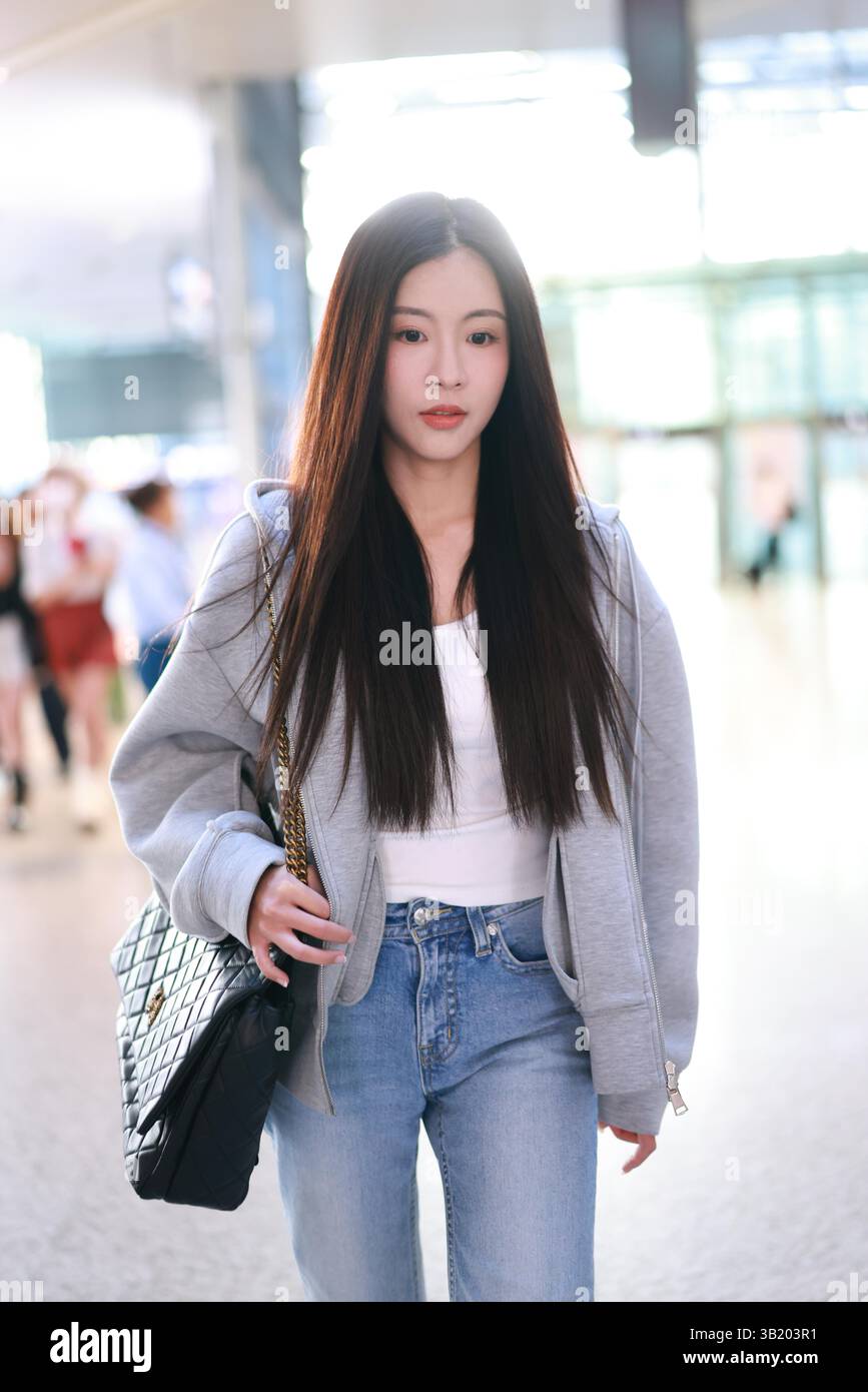 Chinese singer, dancer, and actress Sun Rui appears at the airport in Shanghai, China, 25 April ...