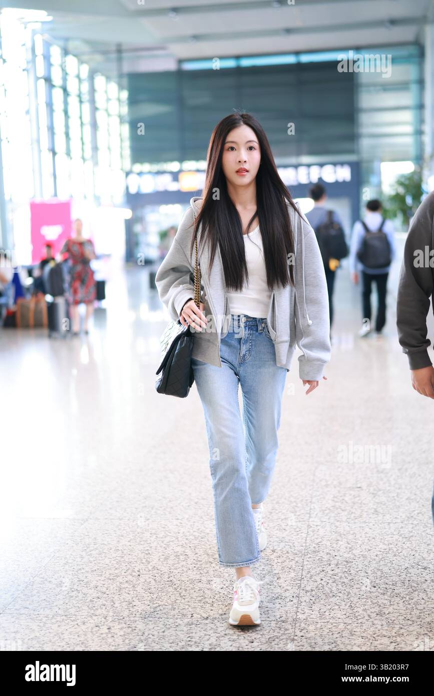 Chinese singer, dancer, and actress Sun Rui appears at the airport in ...