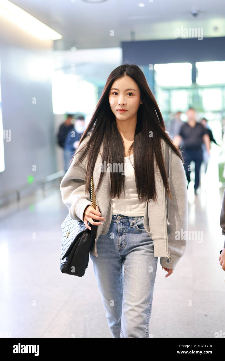 Chinese singer, dancer, and actress Sun Rui appears at the airport in ...