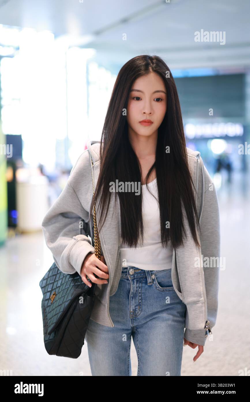 Chinese singer, dancer, and actress Sun Rui appears at the airport in ...