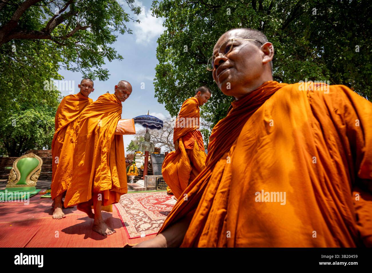 Ayutthaya, Ayutthaya, Thailand. 27th Apr, 2025. Monks walk away from ...