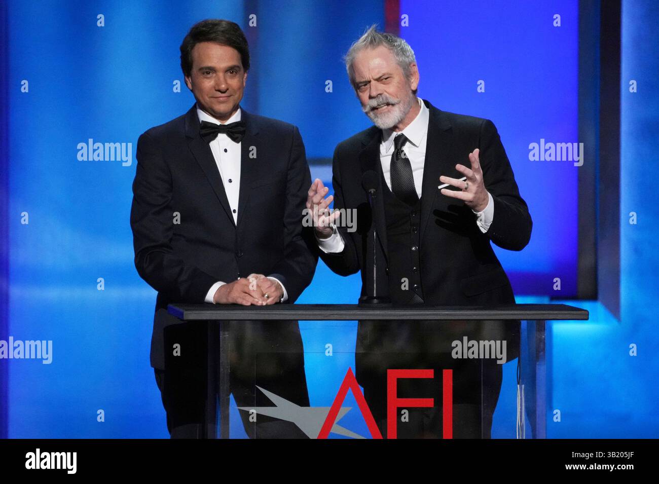 Actors Ralph Macchio, left, and C. Thomas Howell address the audience ...
