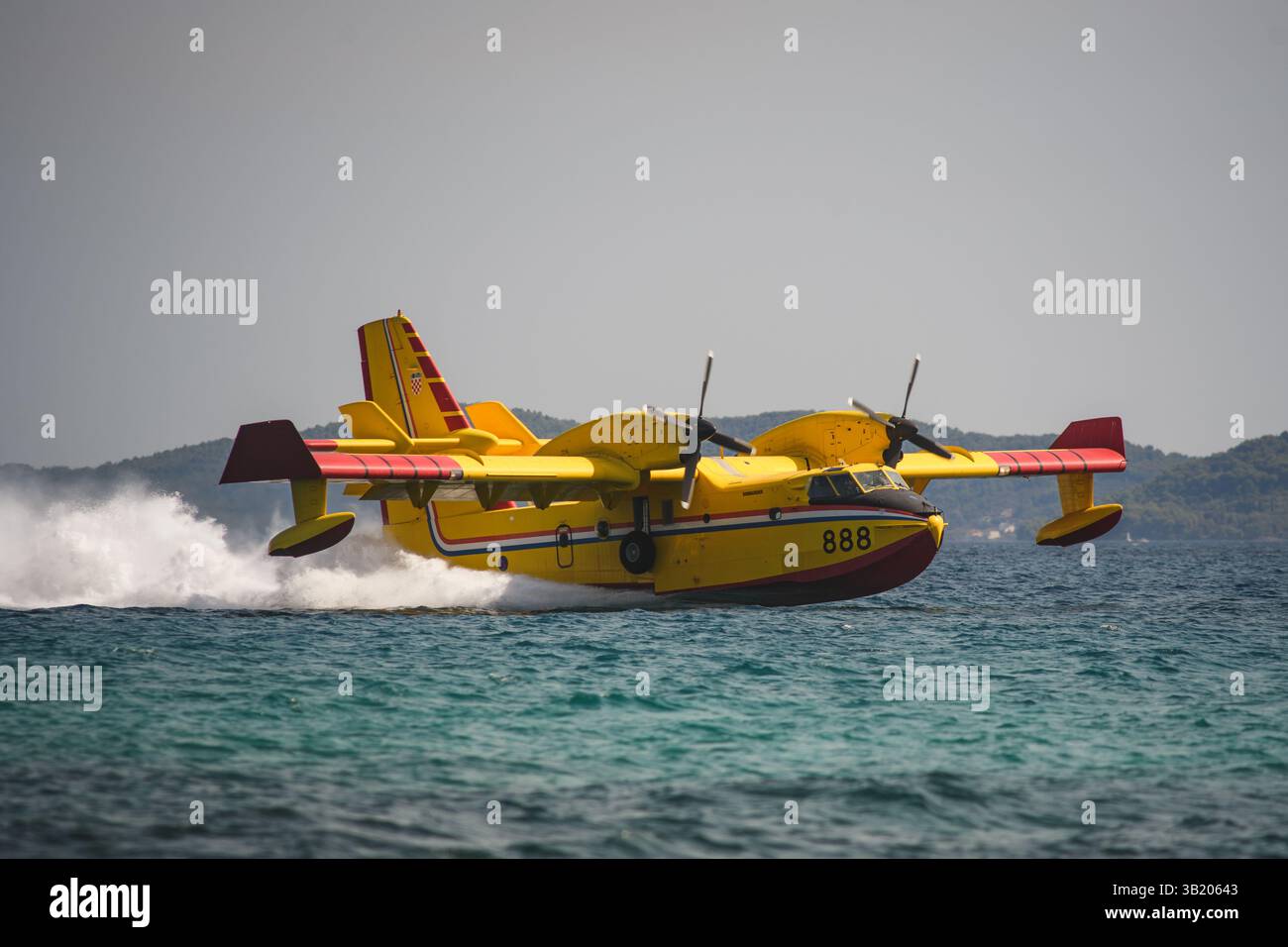 A Croatian Canadair CL-415 firefighting aircraft scooping water from ...