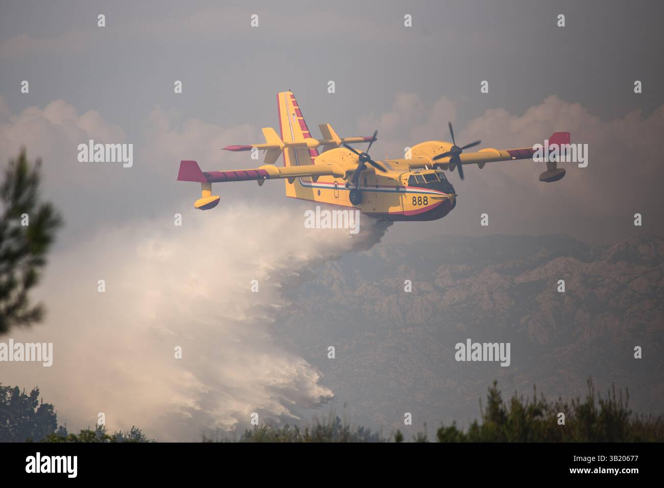 A Croatian Canadair CL-415 firefighting aircraft drops a large load of ...