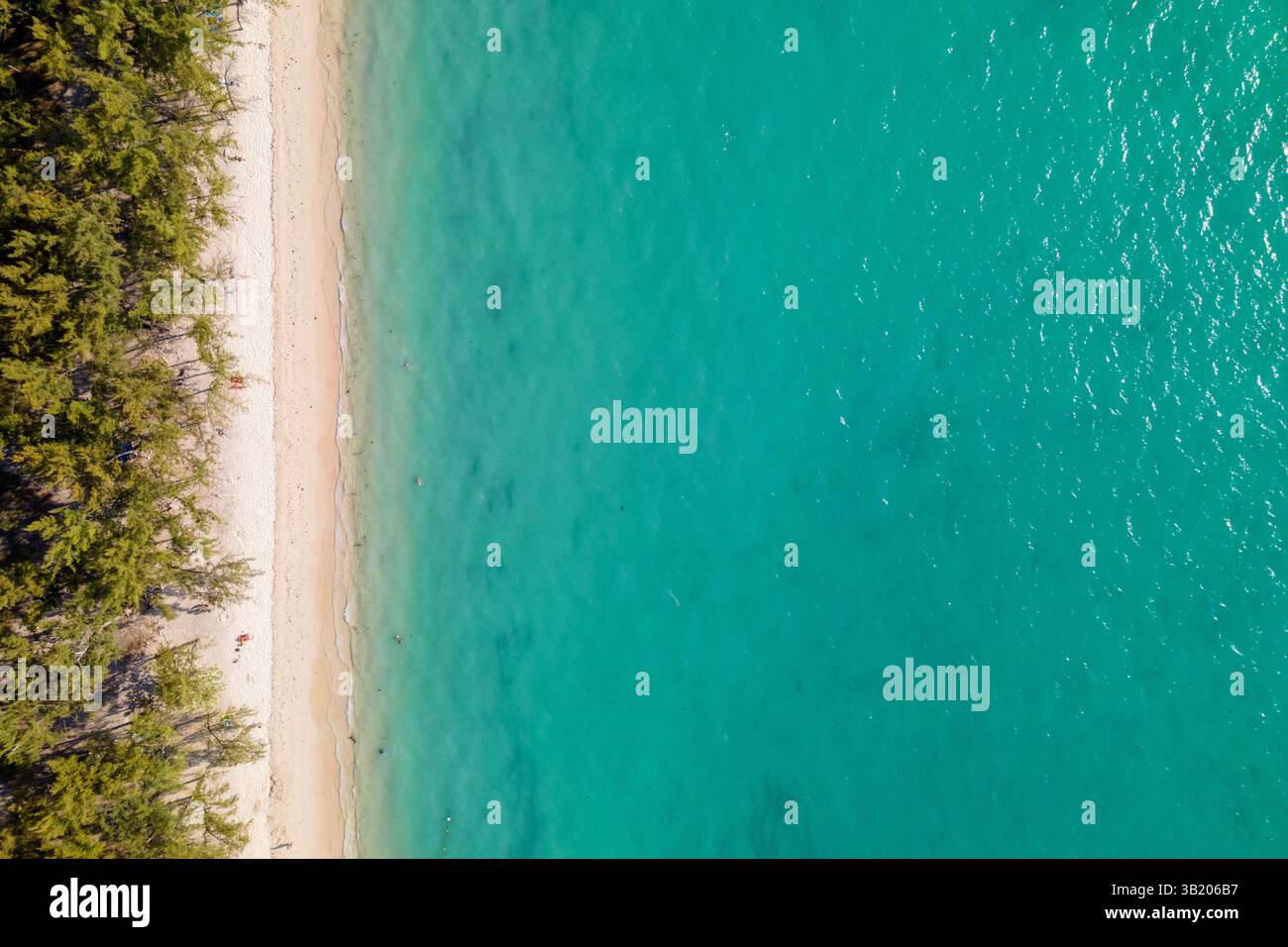 Aerial top view of beautiful turquoise water and white sand tropical "Mon Choisy" public beach ...